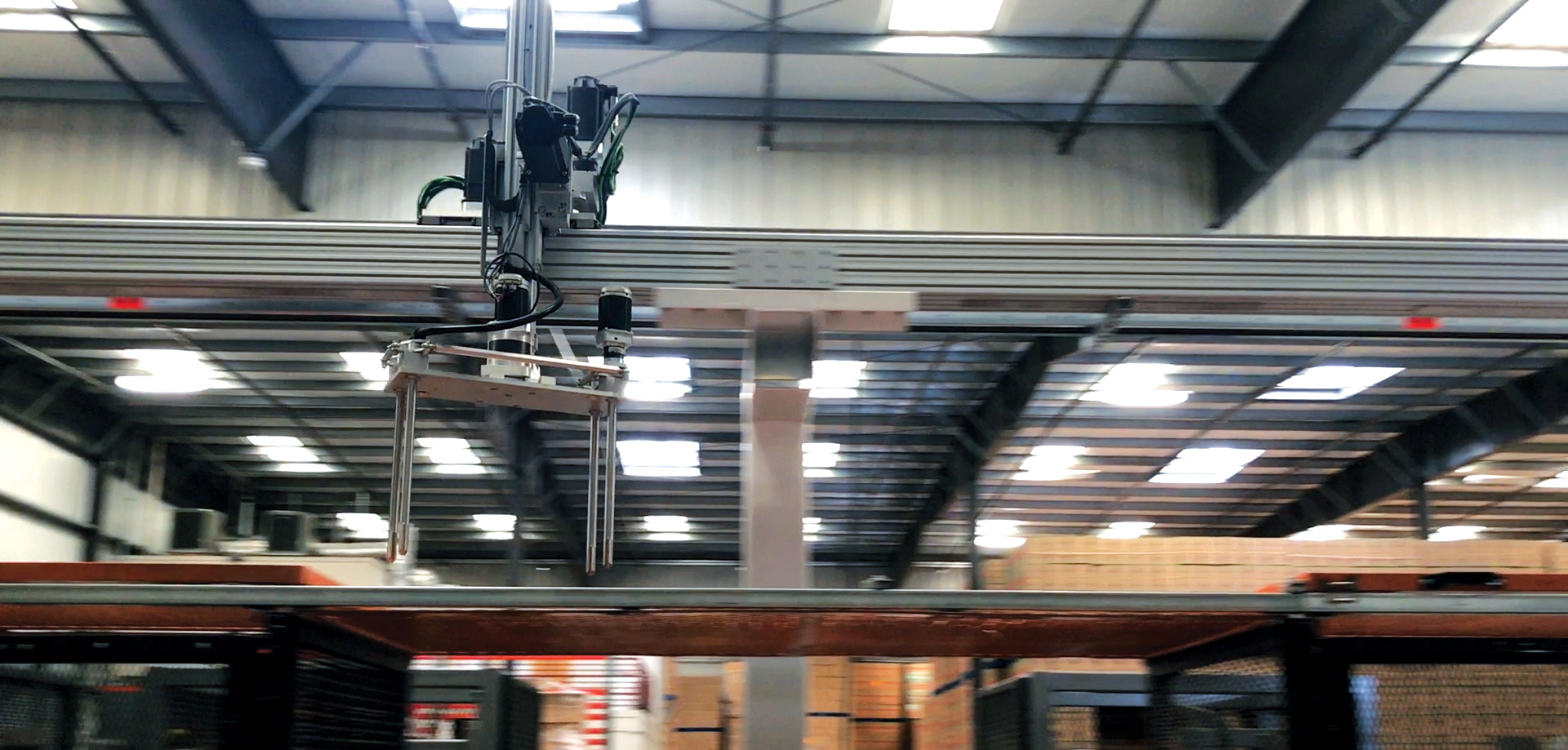 Simplifying overhead machine tending with long-travel automation